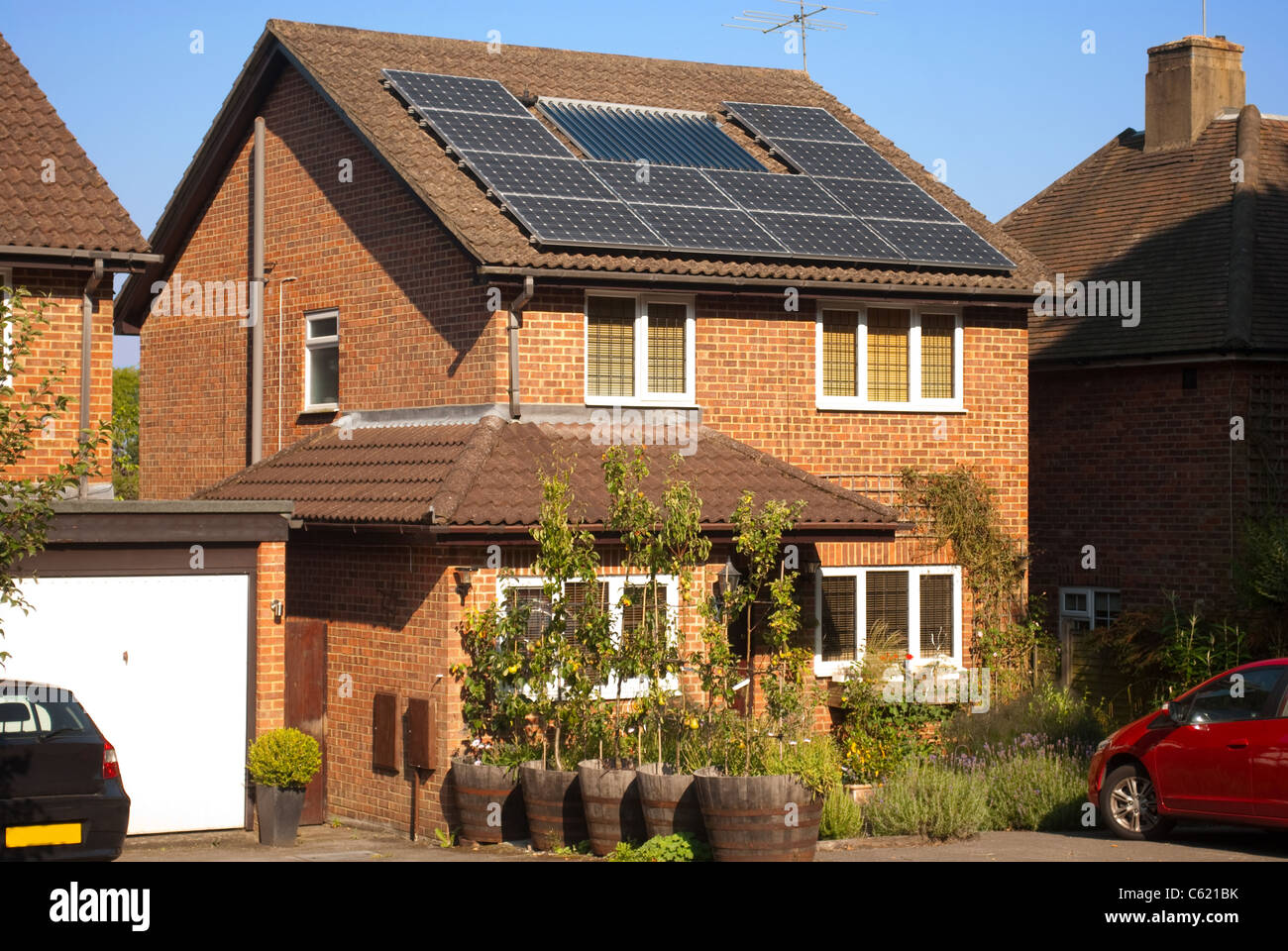 House roof with regenerative energy system - Solar panels Stock Photo ...