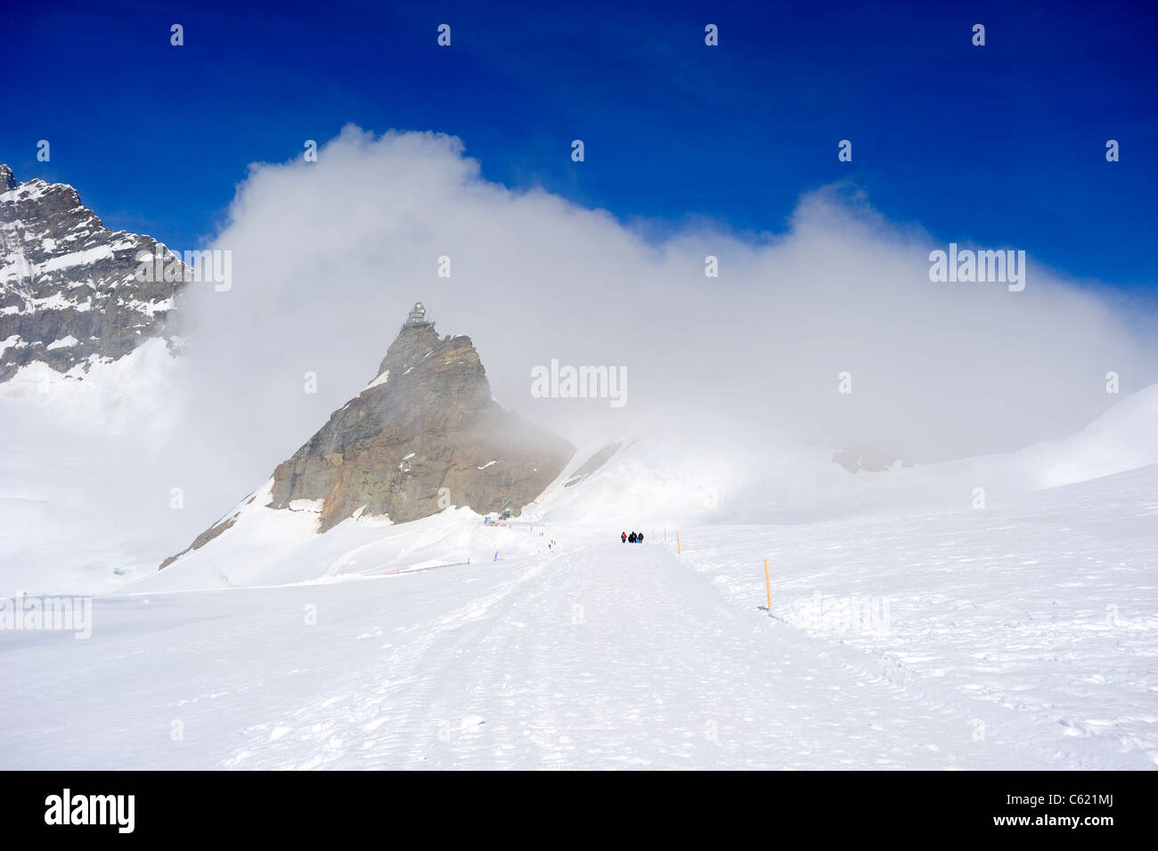 The Jungfraujoch in cloud, looking back at it from the path leading to ...