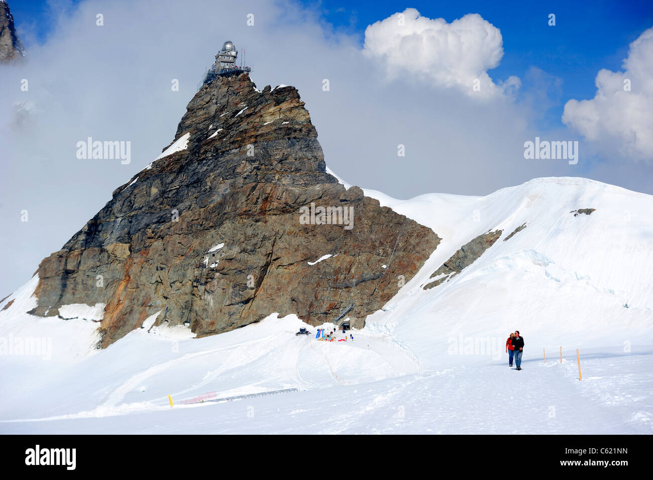 The Jungfraujoch in cloud, looking back at it from the path leading to ...