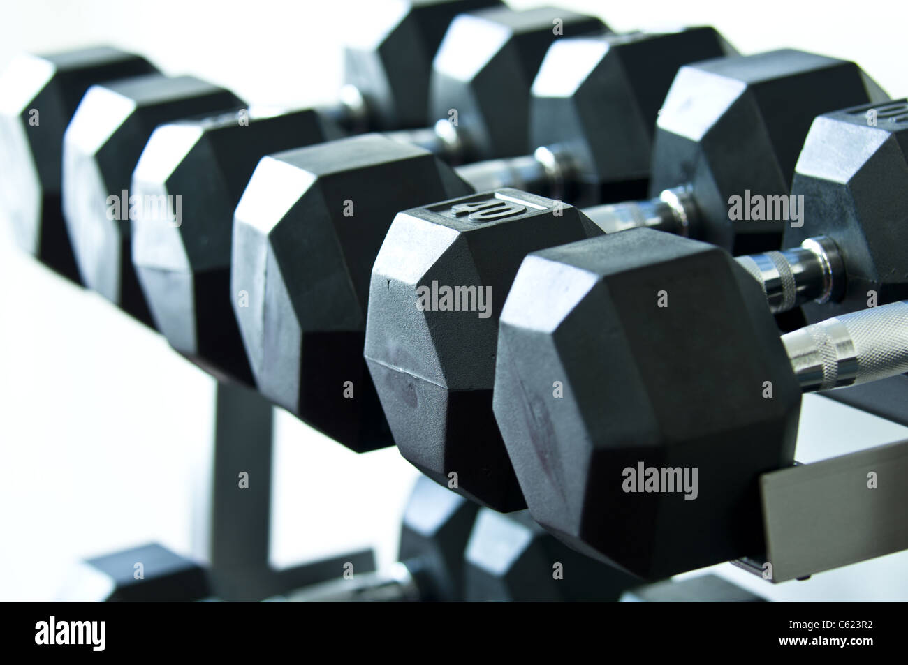 Weights of a gym different sizes and weights black Stock Photo - Alamy