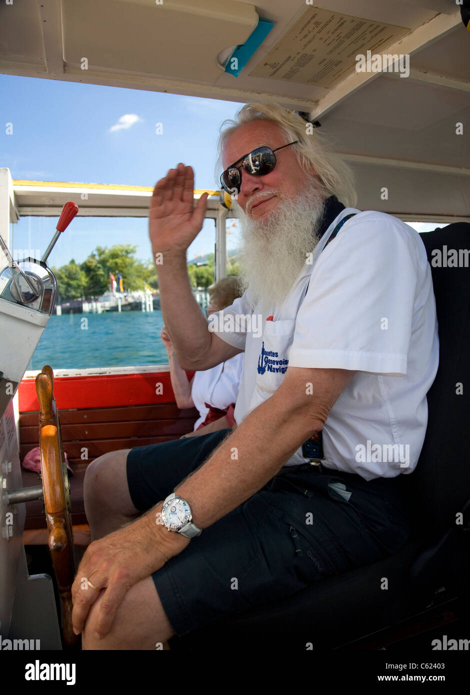 Driver of water taxi crossing Lake Geneva Stock Photo - Alamy