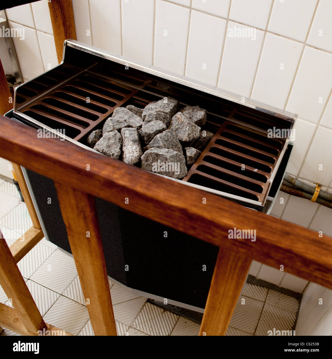 Detail of an electric steam sauna heater with rocks Stock Photo - Alamy