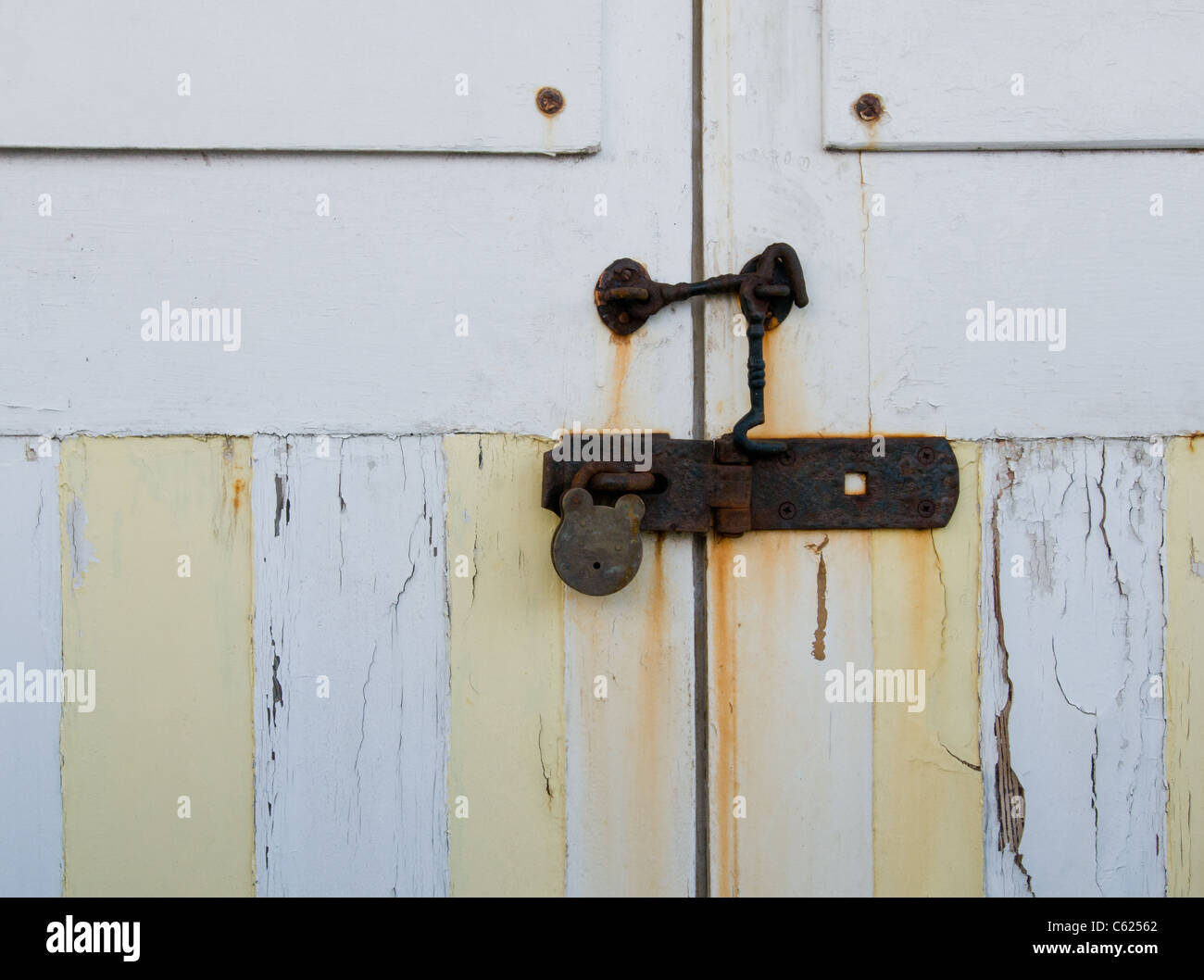 rusting lock on chalet doors Stock Photo - Alamy
