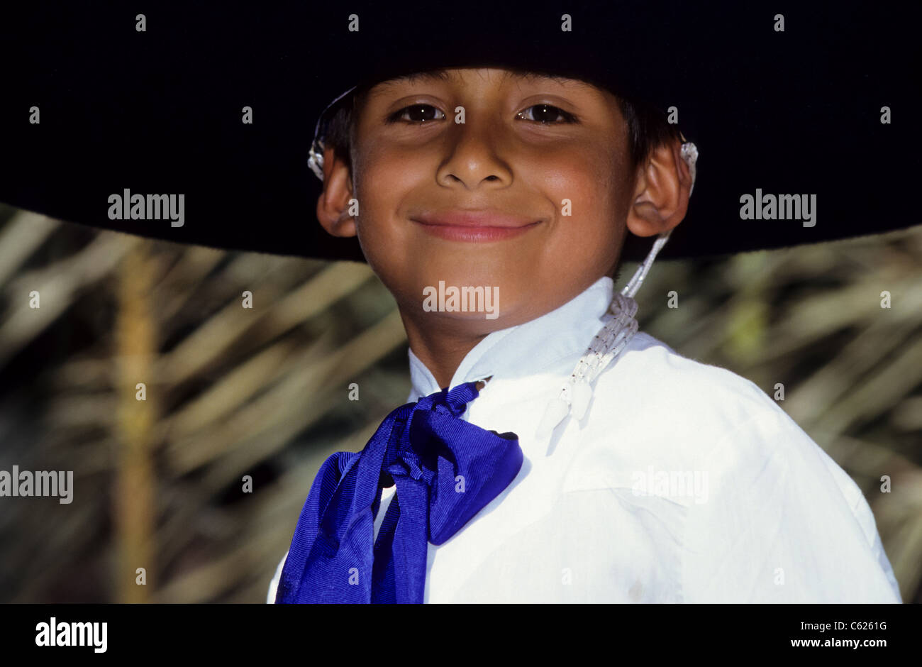 Portrait of a mexican boy in traditional dress with a big hat and a big ...
