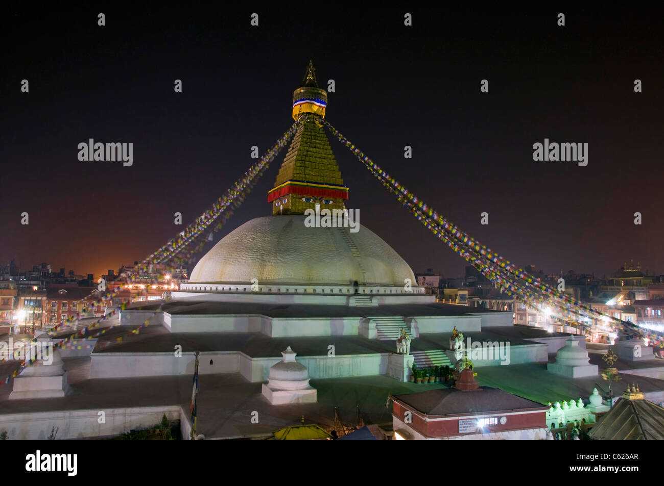 The Boudhanath Stupa photographed at night from one of the terraces ...