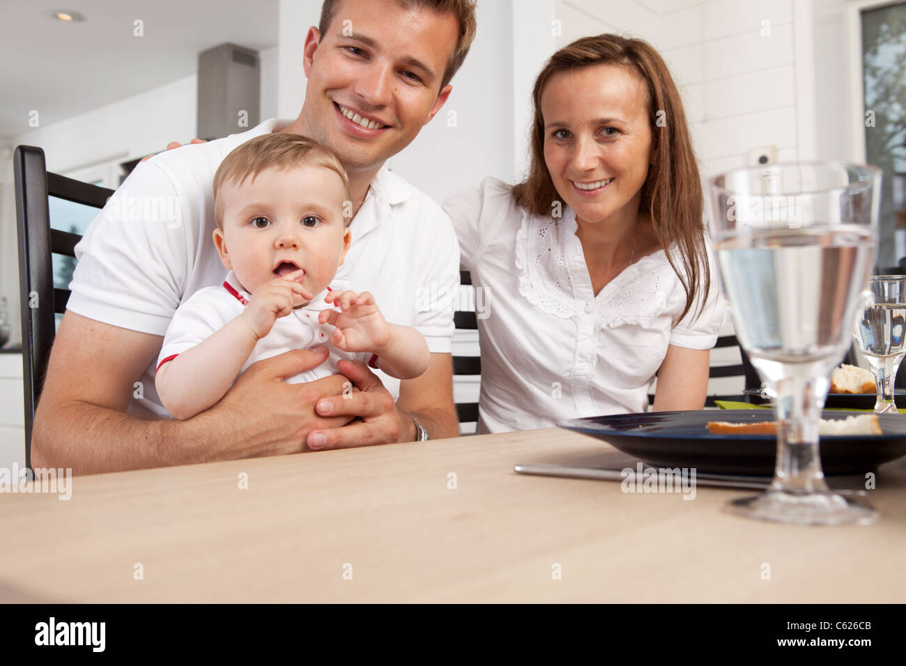 Happy parents with young boy child looking at the camera Stock Photo ...