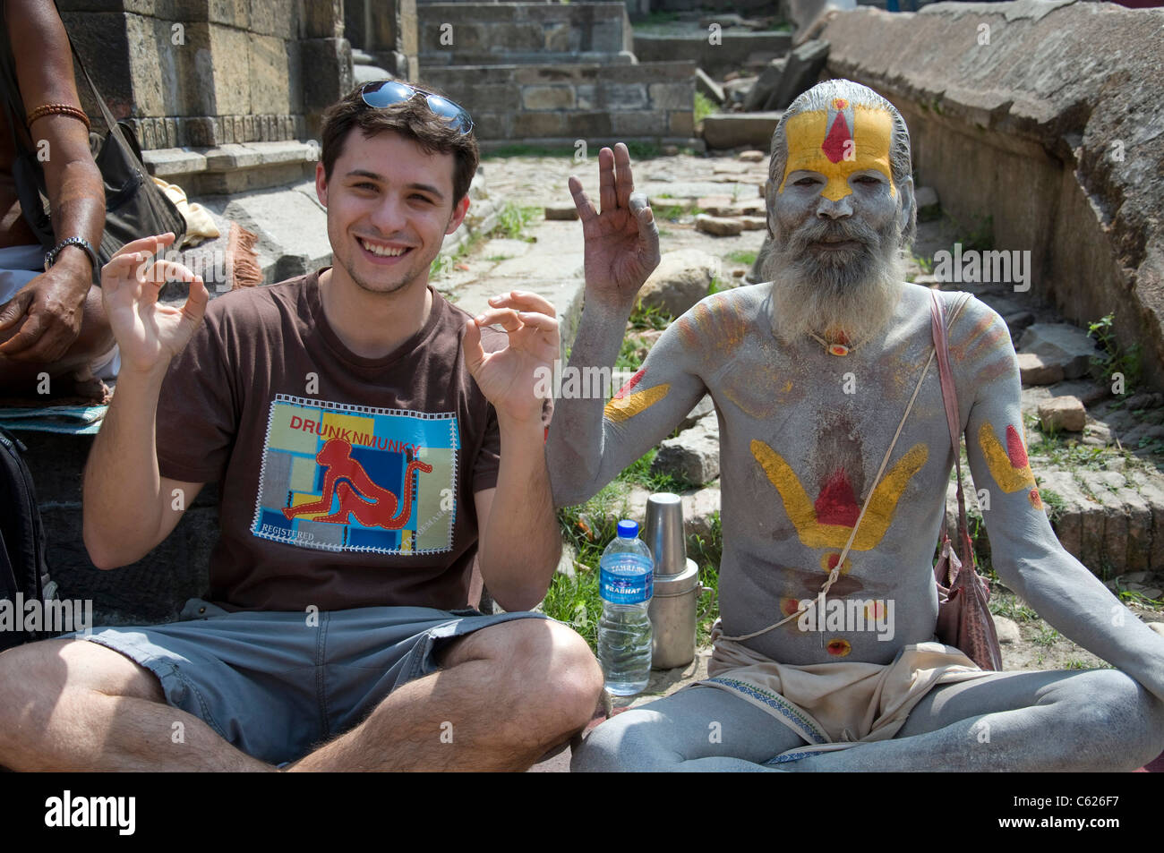Tourist posing with a Baba at Pashupatinath Temple, Kathmandu Stock ...