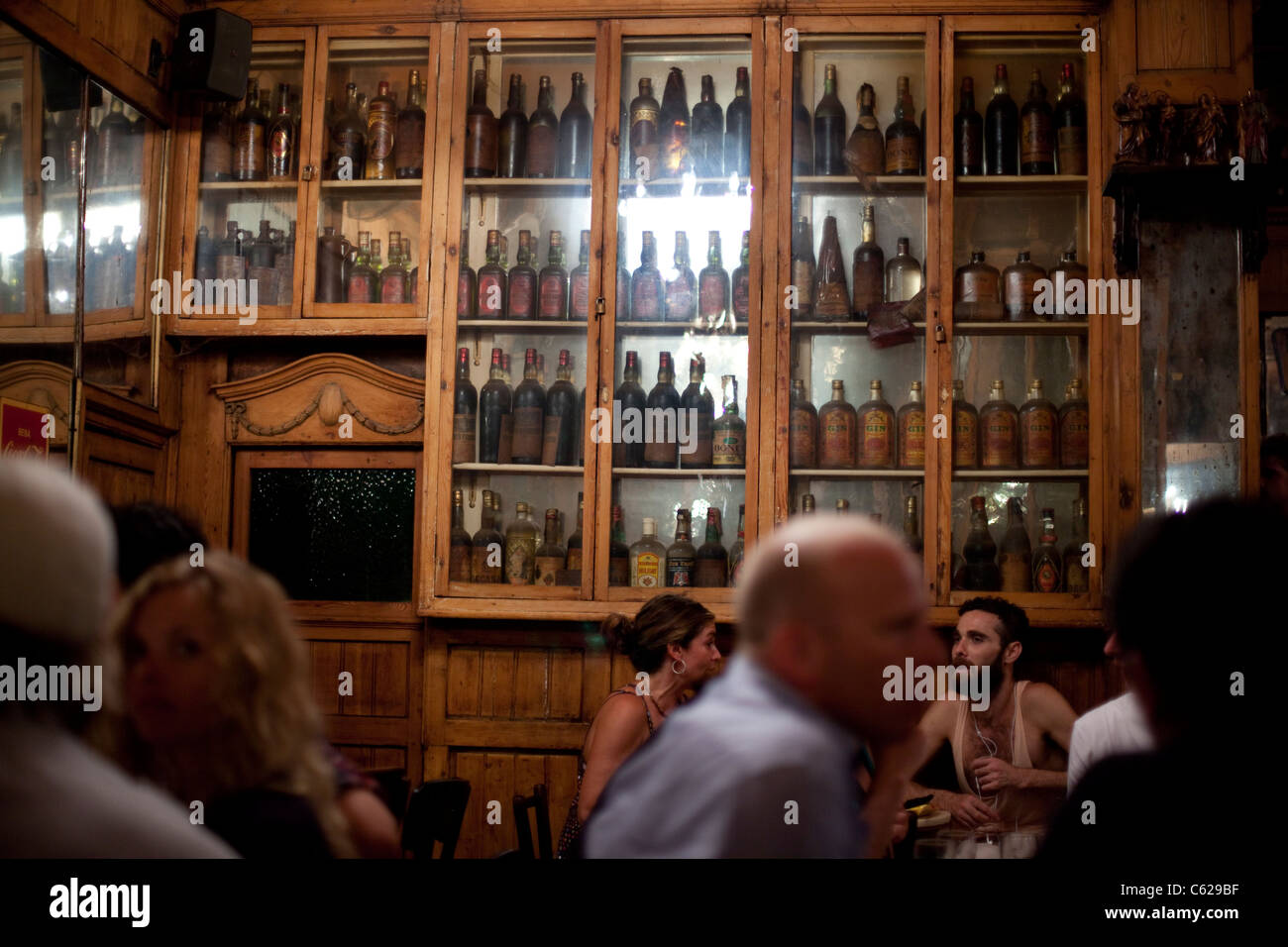 People drinking absinthe in the 200 year old Marsella Bar, Barcelona ...