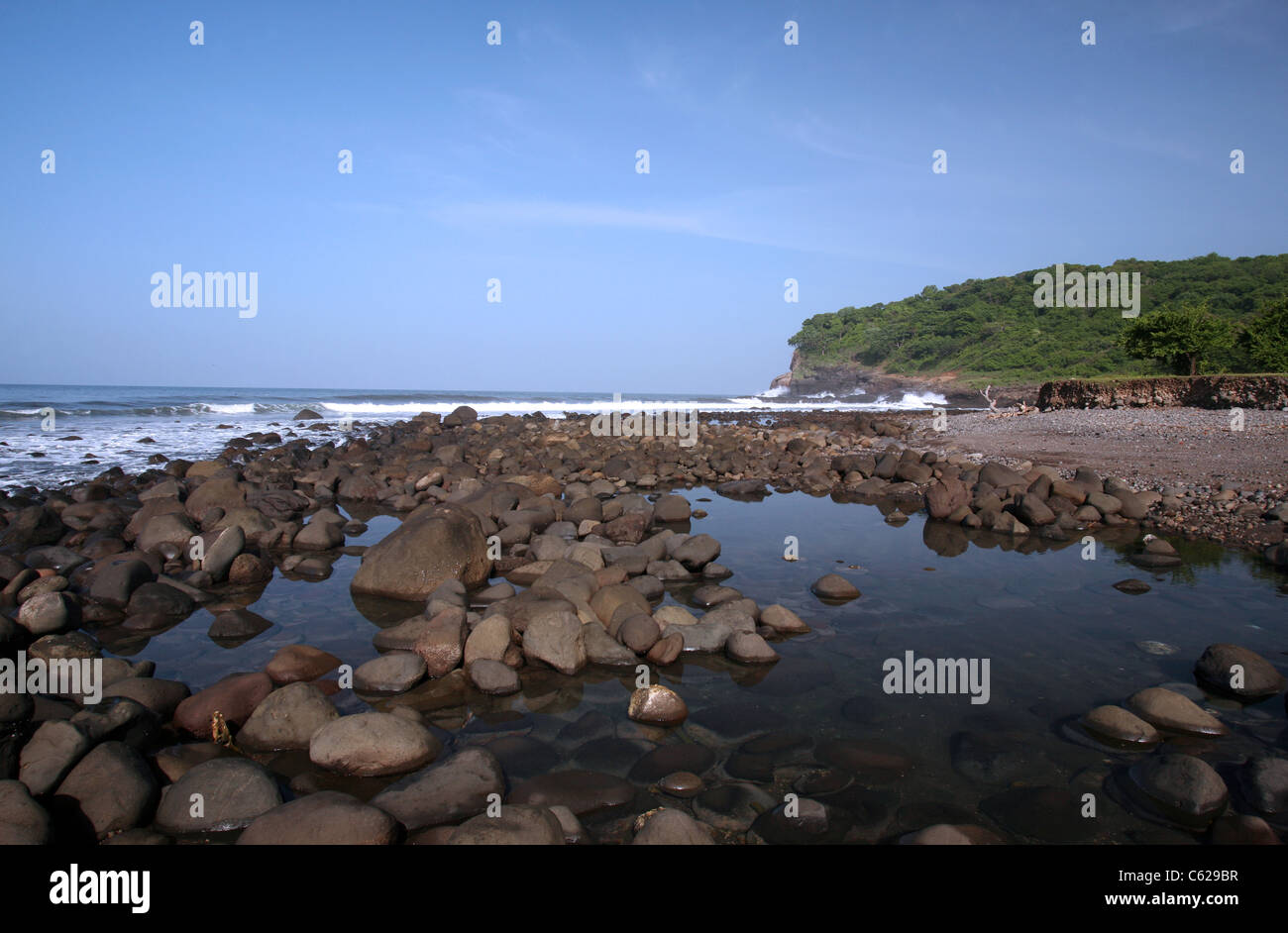 Tidal rock pools at a cobblestone point. La Libertad, El Salvador ...