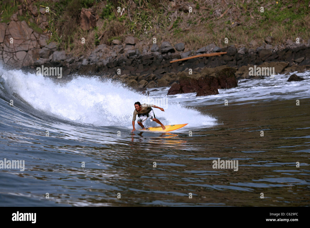 Surfer enjoying a morning surf at the right hand point break. Las ...