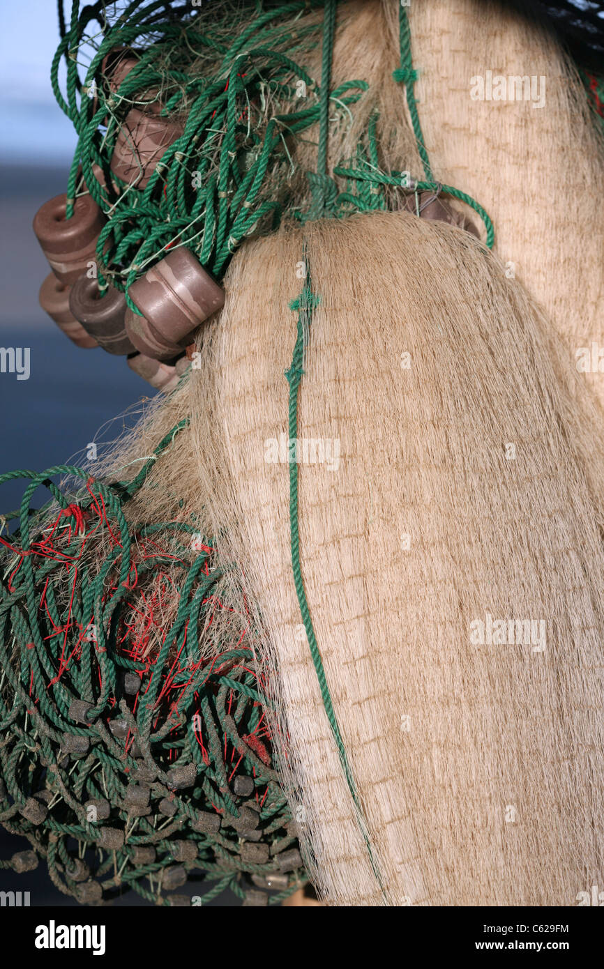 Fishing net hanging out to dry Stock Photo - Alamy