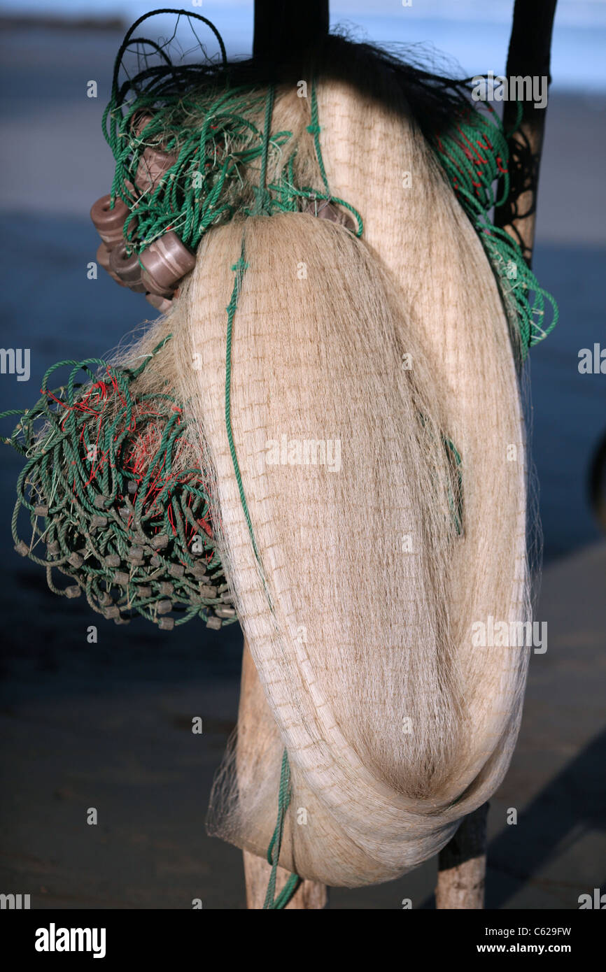 Fishing net hanging out to dry Stock Photo - Alamy