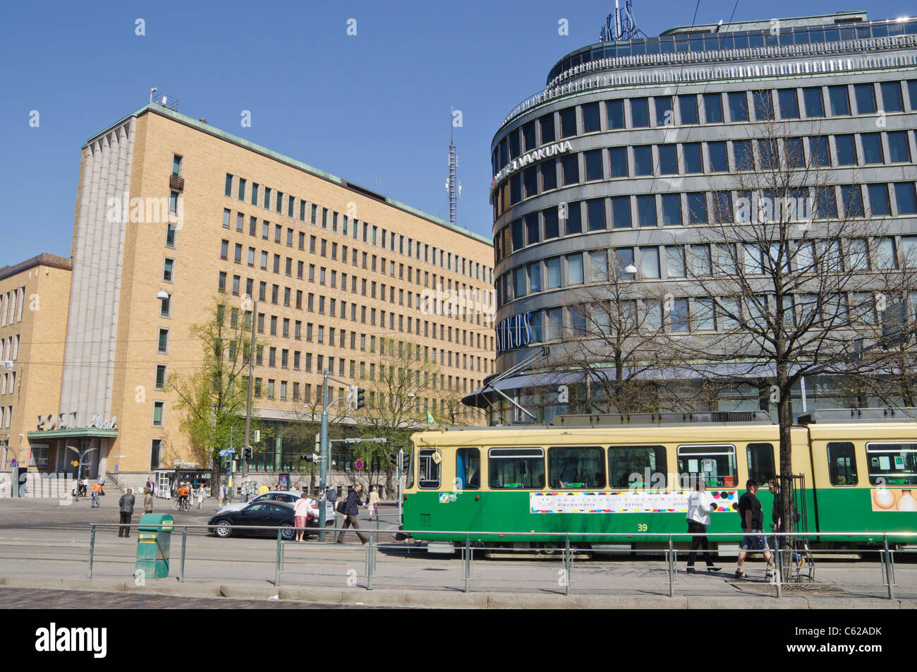 A tram along busy Mannerheimintie in front of the Sokos Department ...