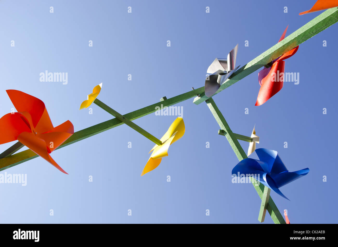 colourful paper windmills on sky background Stock Photo - Alamy