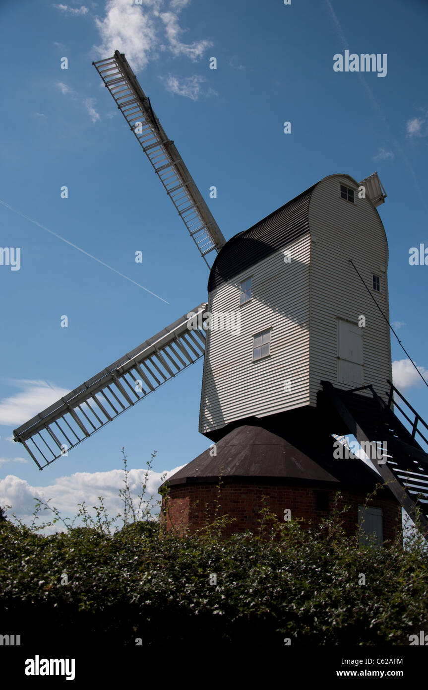 Mountnessing Post Mill set in the english countryside with a blue sky ...