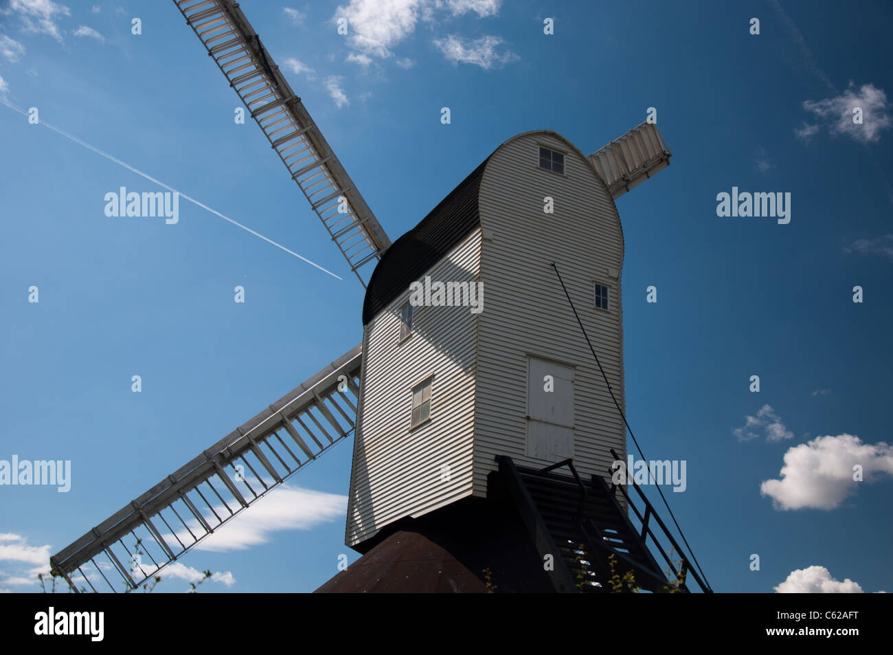 Mountnessing Post Mill set in the english countryside with a blue sky ...