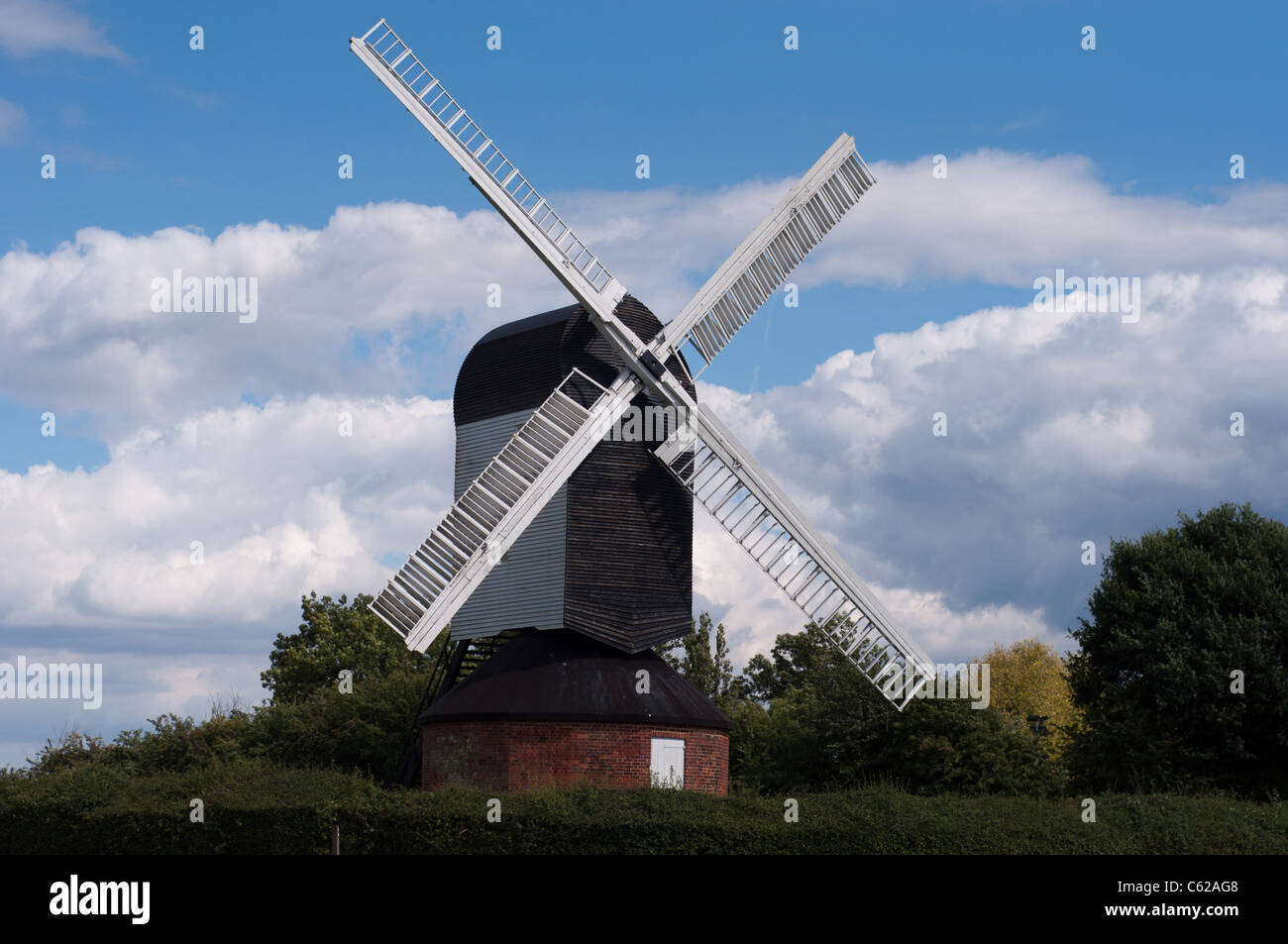 Mountnessing Post Mill set in the english countryside with a blue sky ...