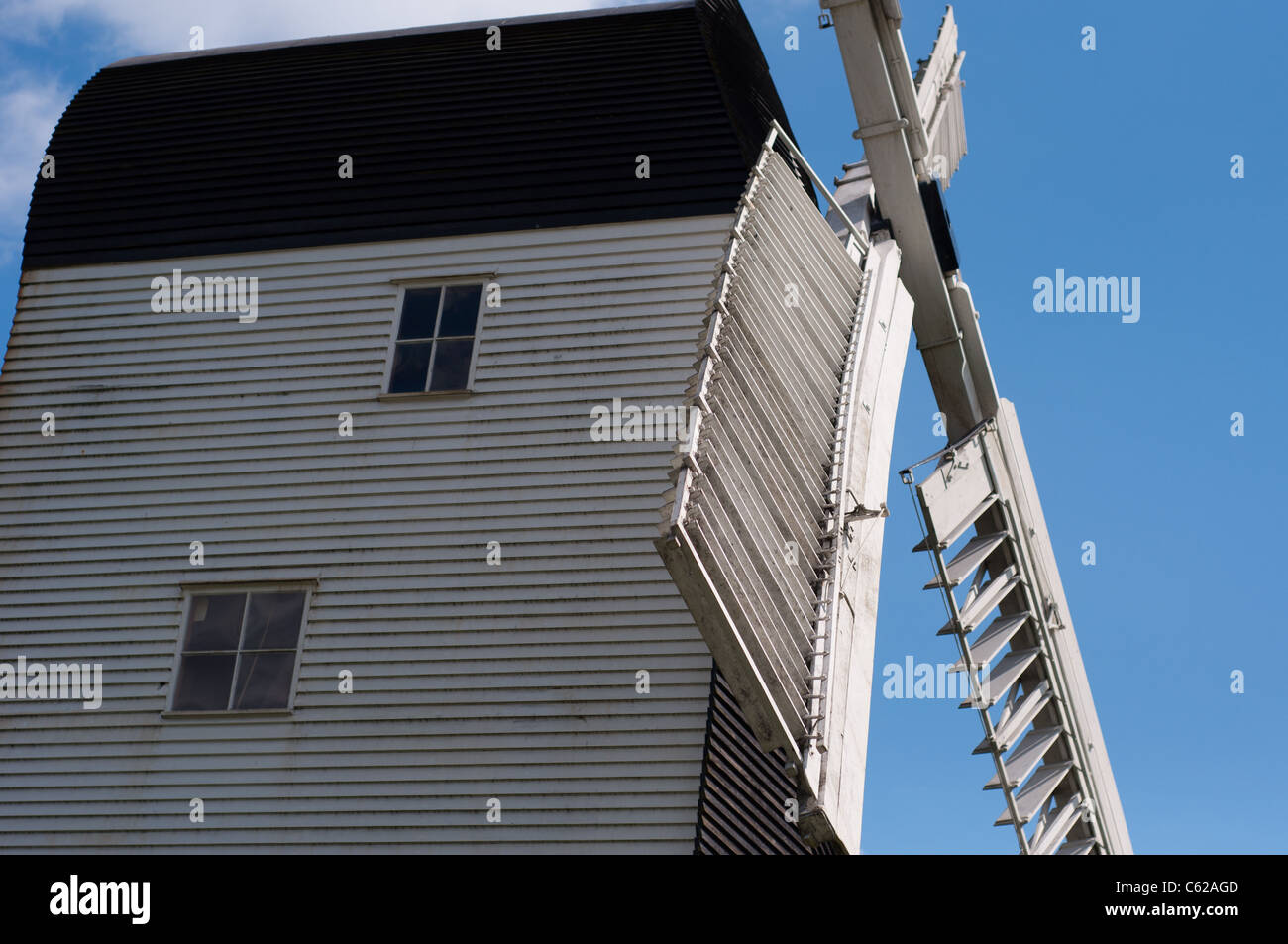Mountnessing Post Mill set in the english countryside with a blue sky ...