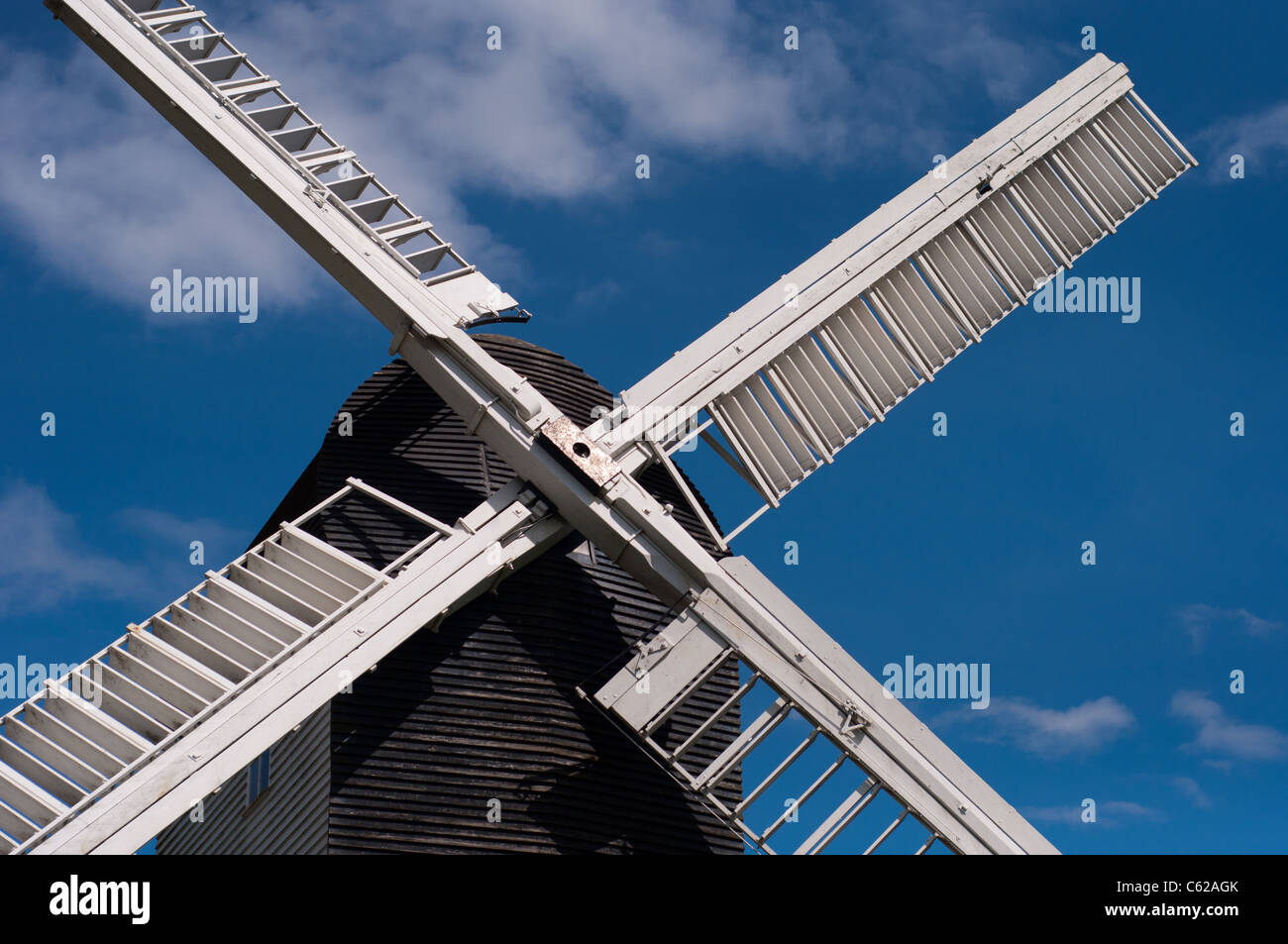 Mountnessing Post Mill set in the english countryside with a blue sky ...