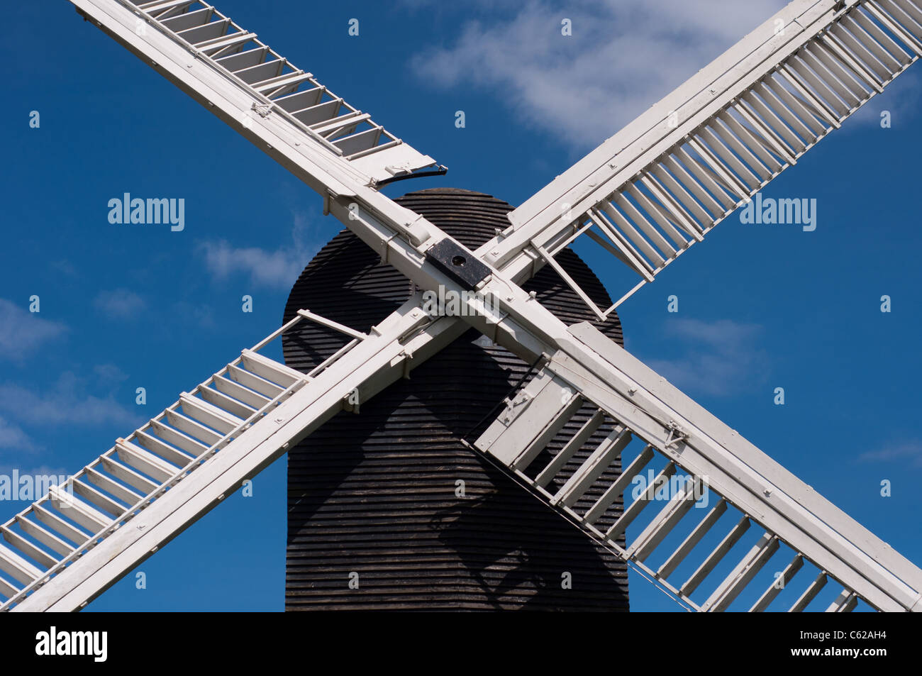 Mountnessing Post Mill set in the english countryside with a blue sky ...