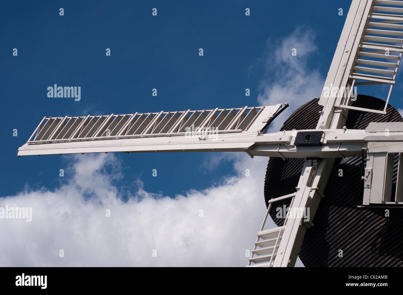 Mountnessing Post Mill set in the english countryside with a blue sky ...
