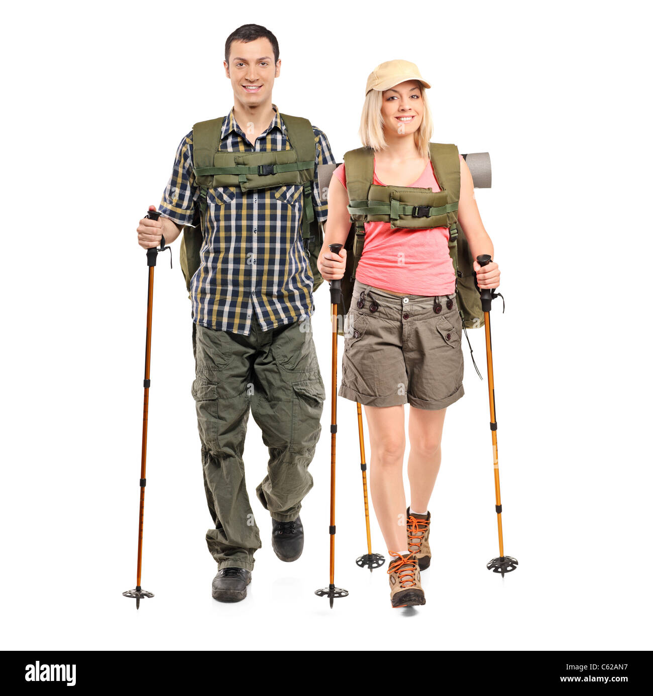 Full length portrait of a man and woman with backpacks and hiking poles ...
