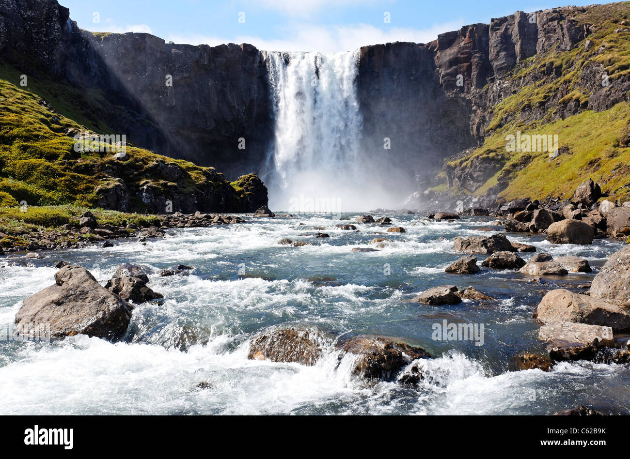 Gufufoss waterfall above the village of Seydisfjordur, Eastern Fjords ...