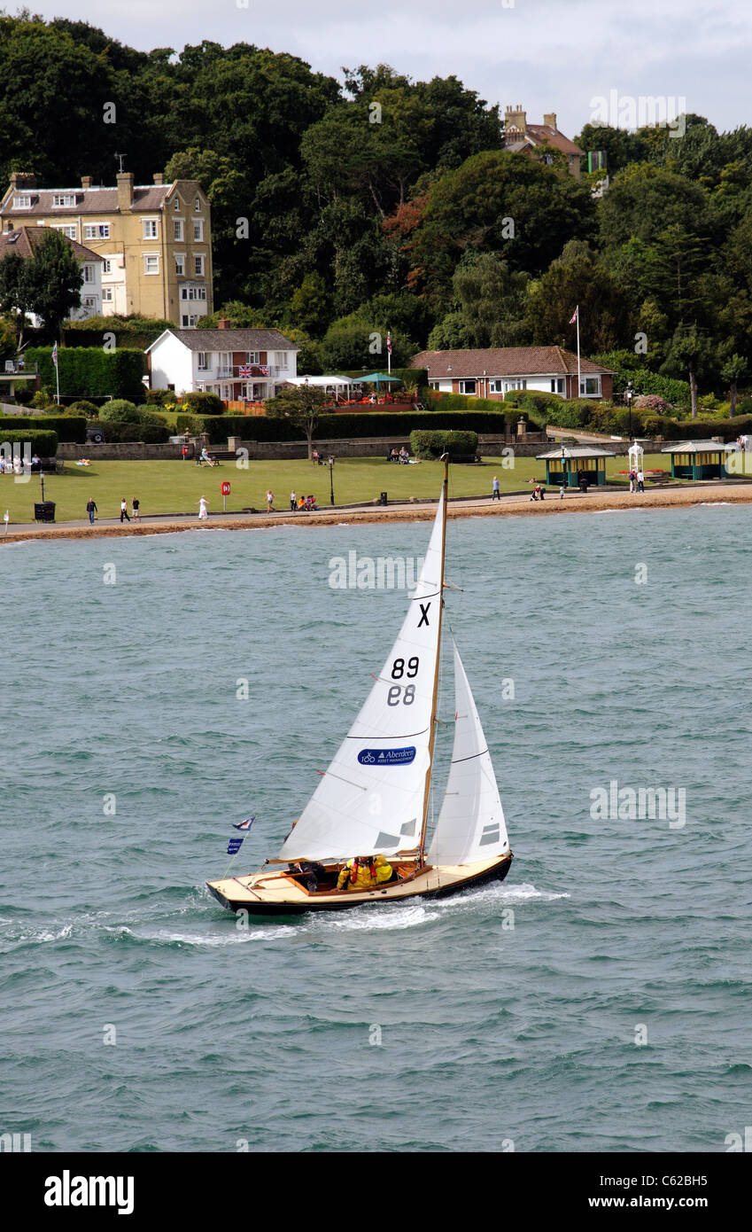 Sailing boat underway on The Solent with a backdrop of the Isle of ...