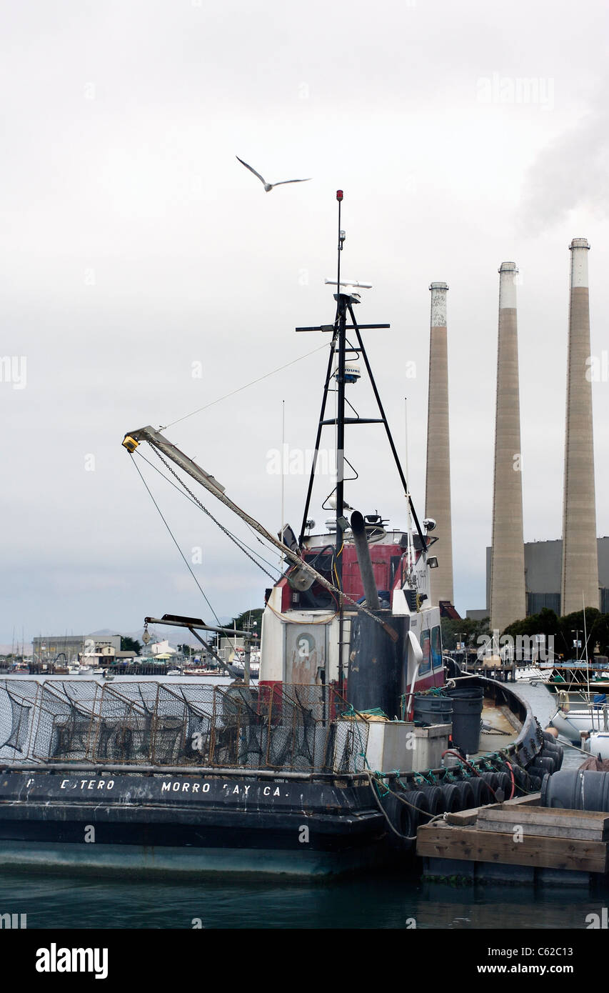 Fishing boat and power plant smoke stacks in Morro Bay, California ...