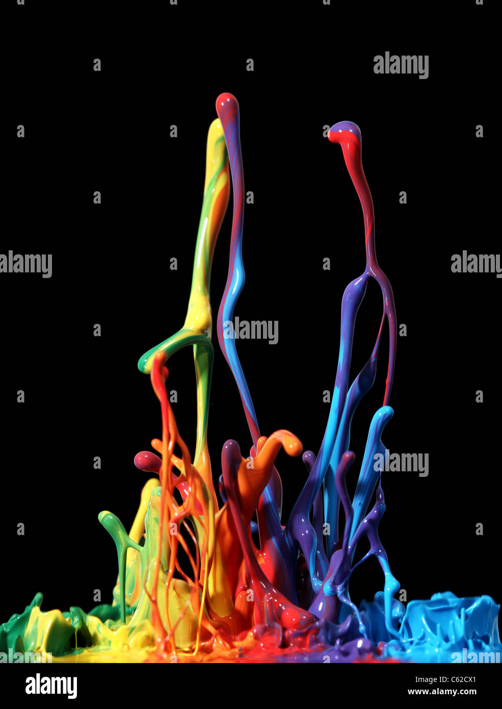 Colorful paint splashing isolated on white Stock Photo - Alamy
