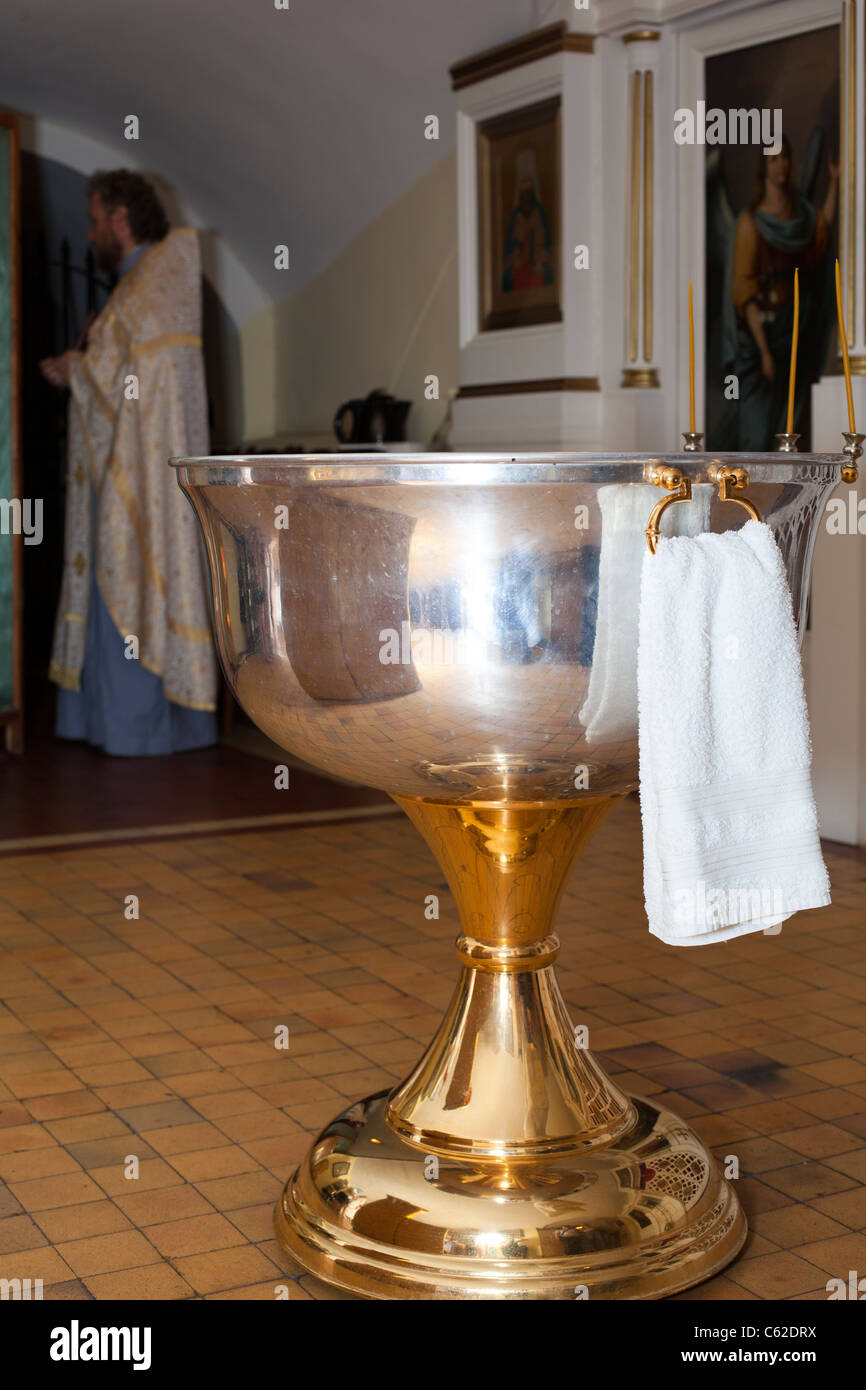 Supplies for Baptism in Russian orthodox church: table, cross, book and ...