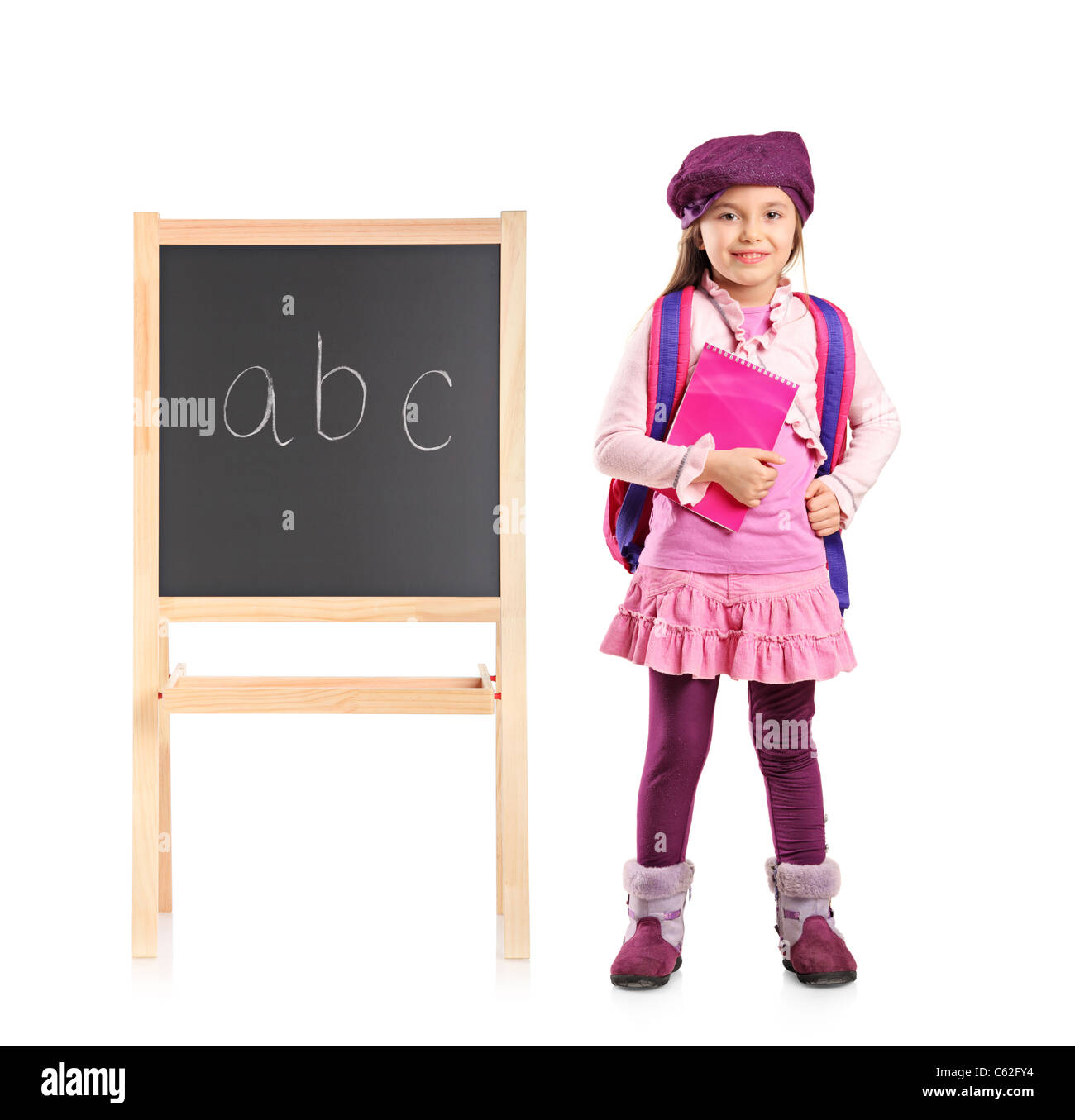 Full length portrait of a school kid posing next to a school board ...
