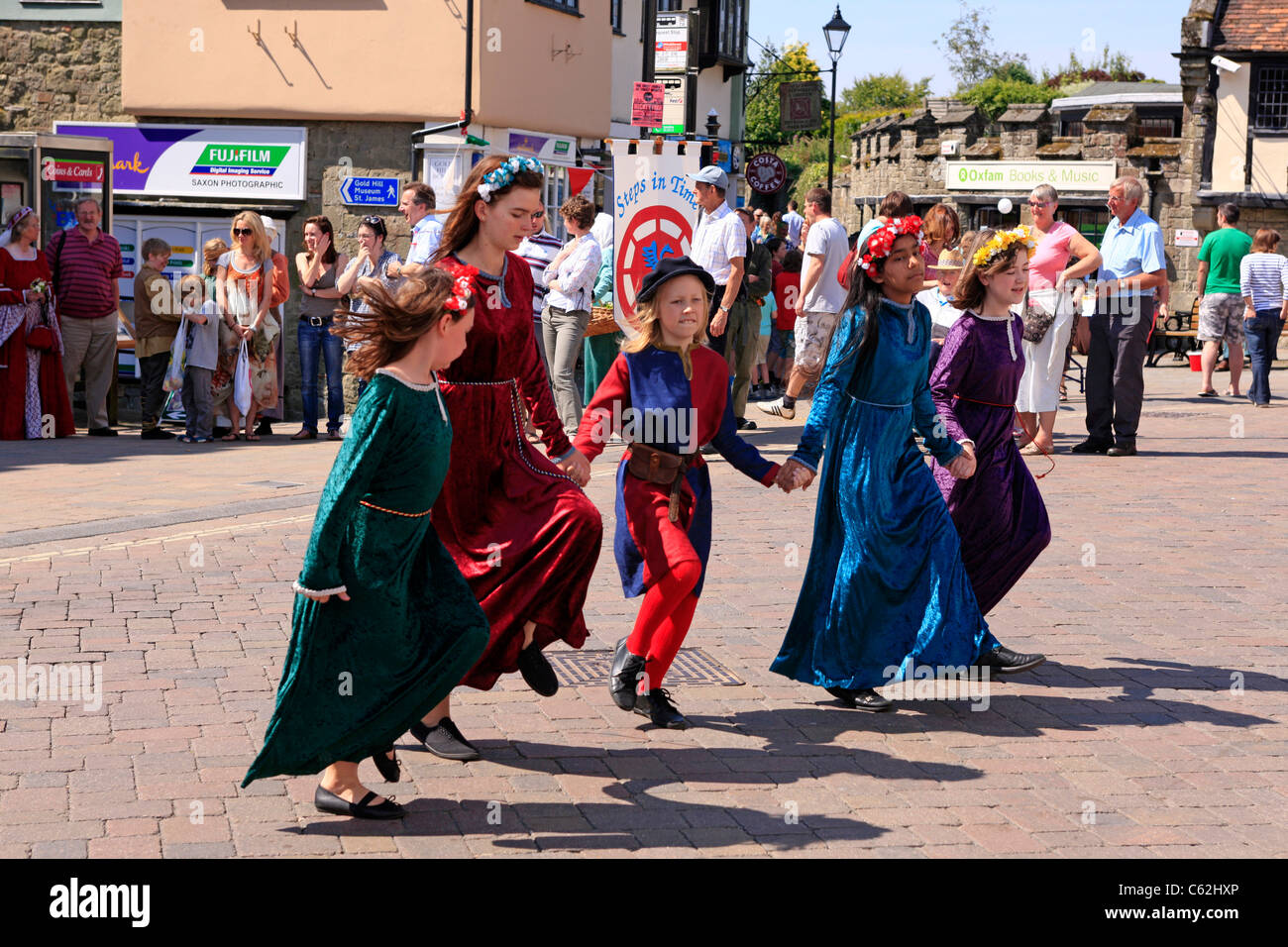 Teenagers dancing in the streets during the medieval pageant at ...