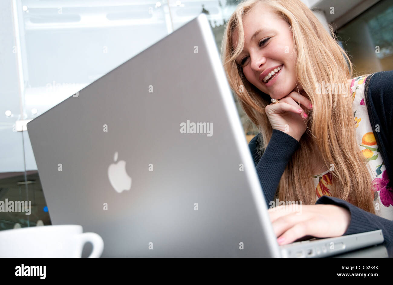 young female person using laptop computer Stock Photo - Alamy