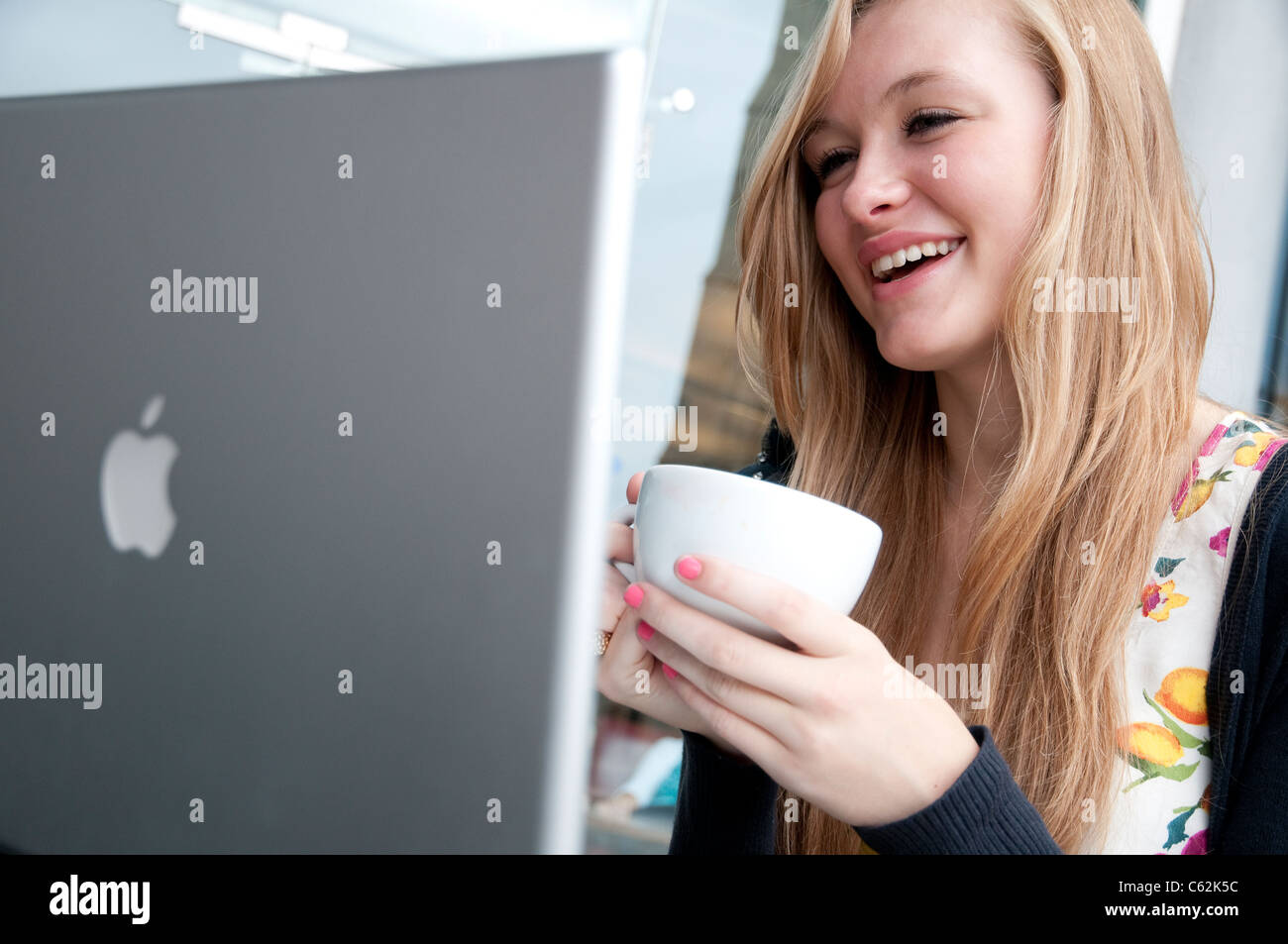 young female person using laptop computer Stock Photo - Alamy