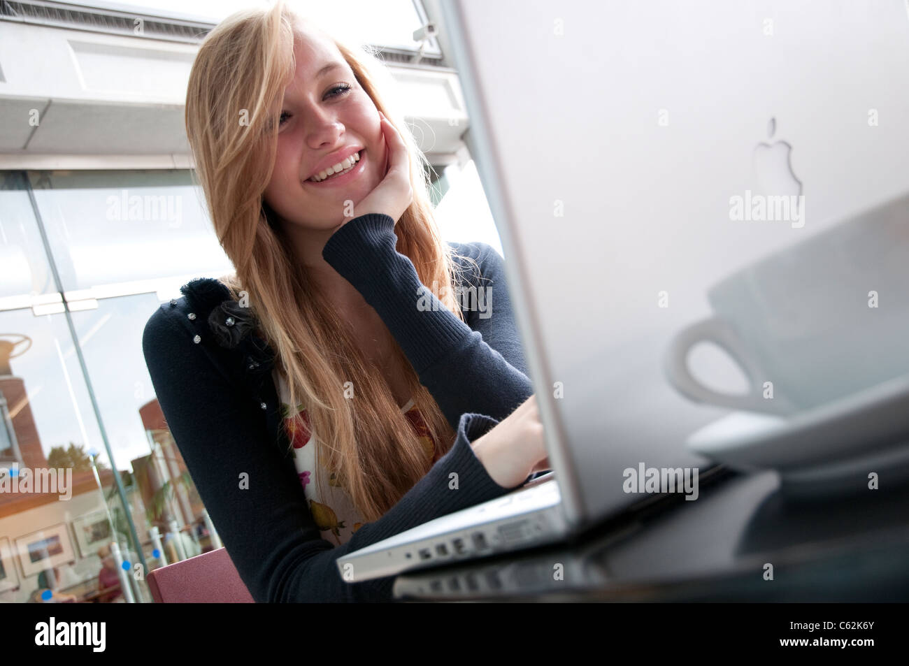 young female person using laptop computer Stock Photo - Alamy