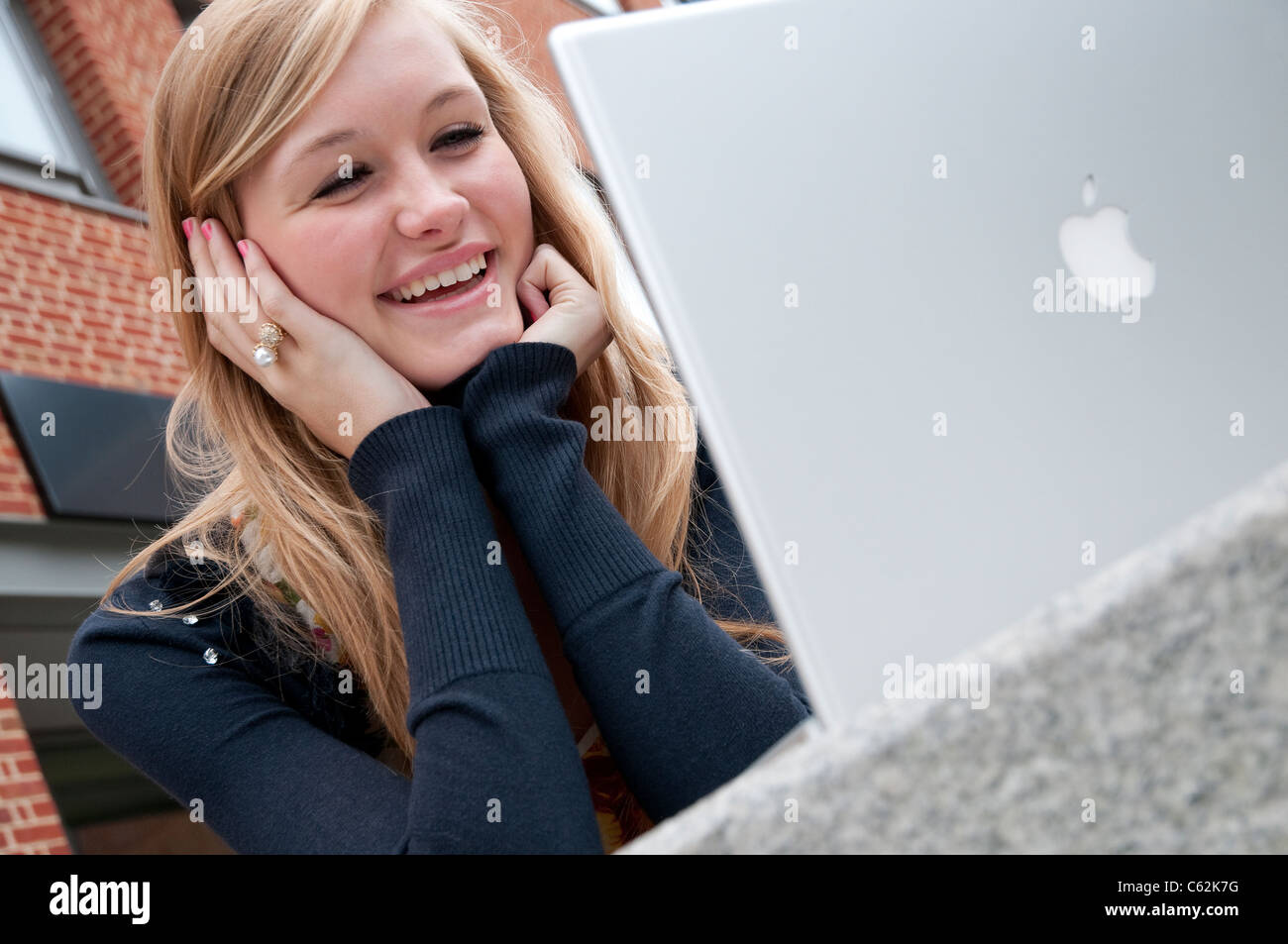 young female person using laptop computer Stock Photo - Alamy