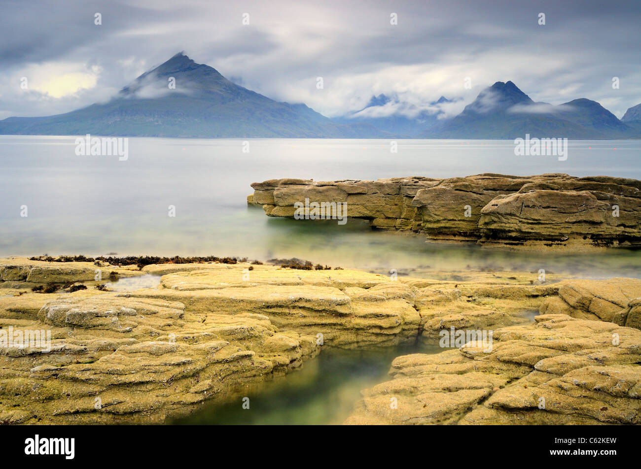 Calm Loch Scavaig and the Black Cuillin peaks of Gars-Bheinn and Sgurr ...