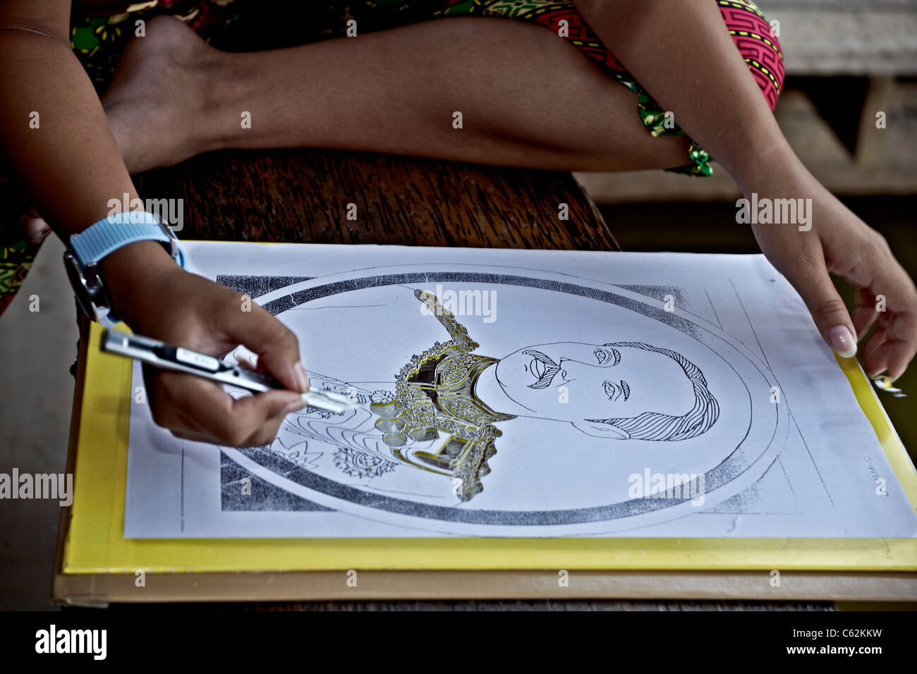 Artist sketching a gold inlay portrait of the late Thailand King Rama V ...