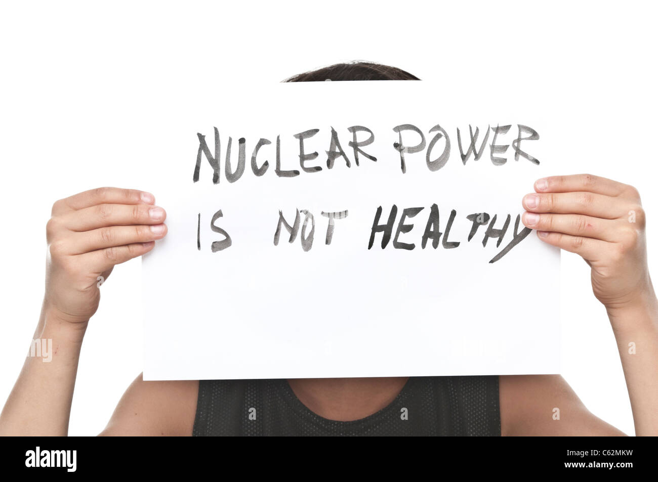 unrecognizable boy holding up a anti nuclear sign Stock Photo - Alamy
