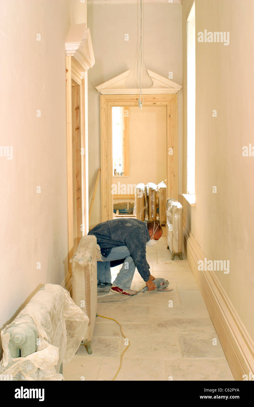 UK property developers workmen working on refurbishment of old house ...