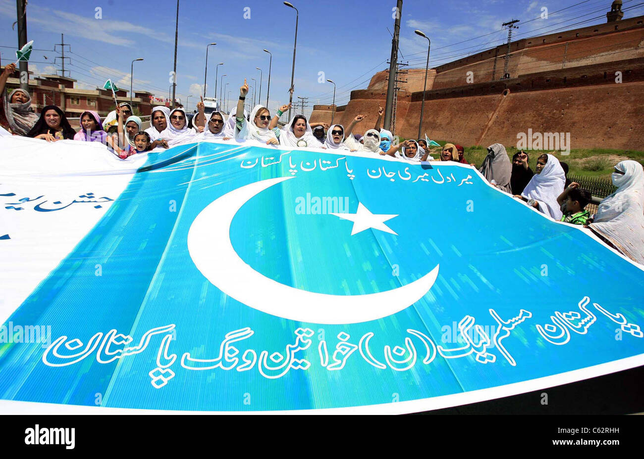 Muslim women pass through hi-res stock photography and images - Alamy