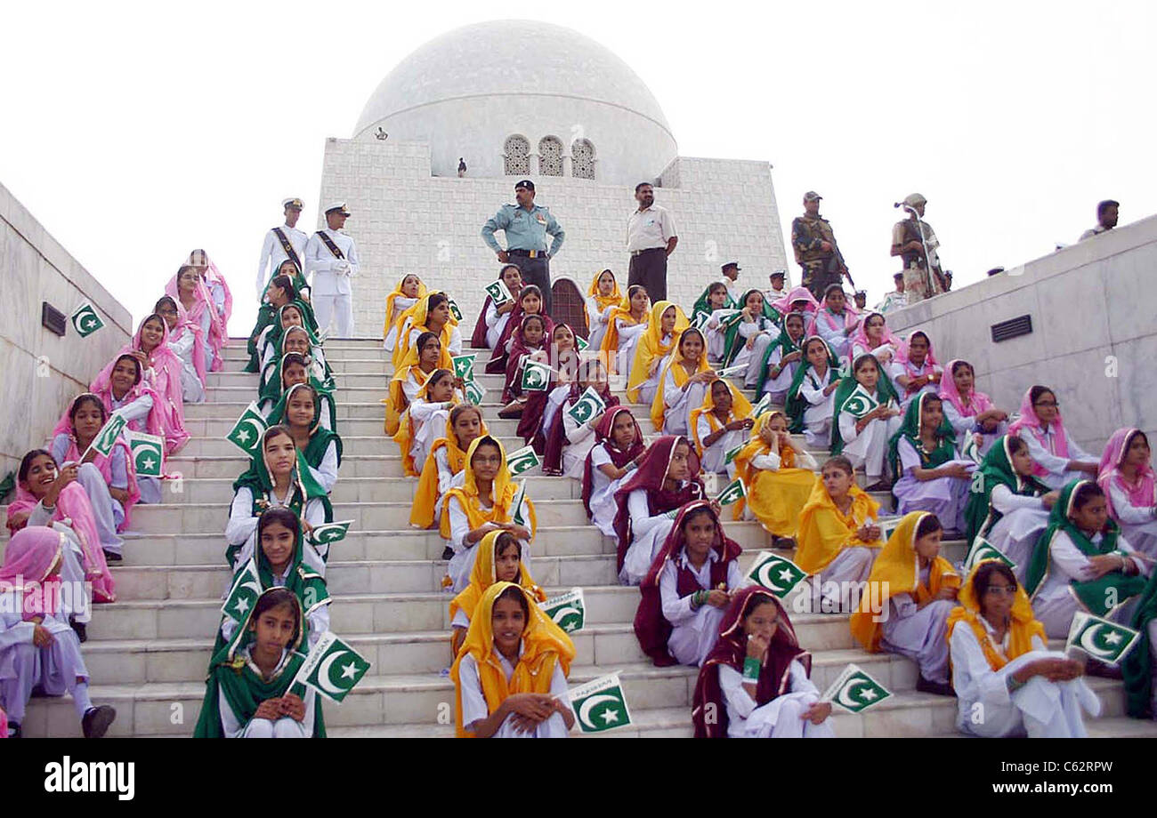 Students hold national flags are present during ceremony on occasion of ...