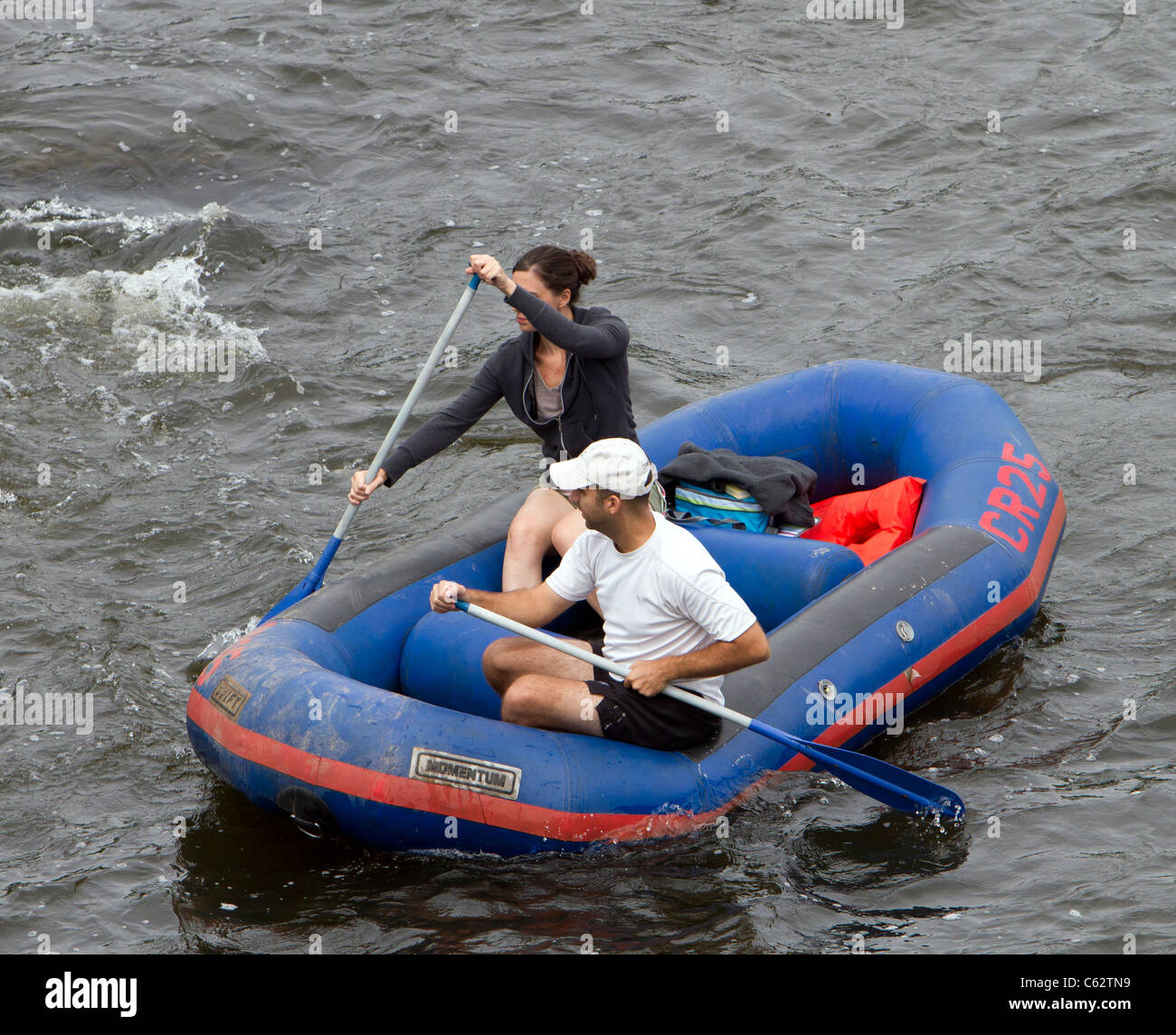 Young couple man and woman rafting on a river Stock Photo - Alamy