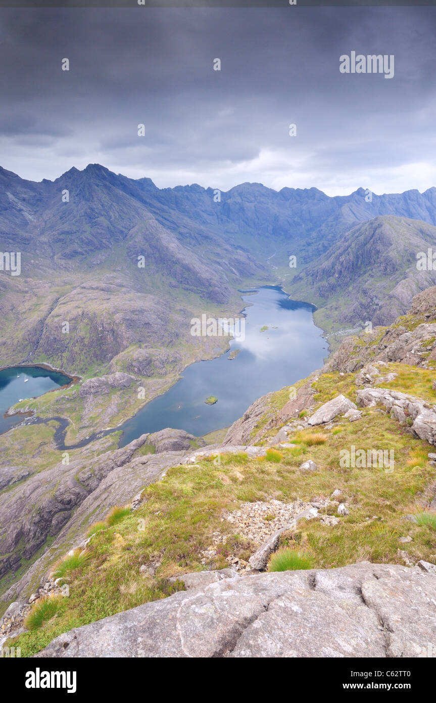 Calm blue waters of Loch Coruisk and the jagged peaks of the Black ...