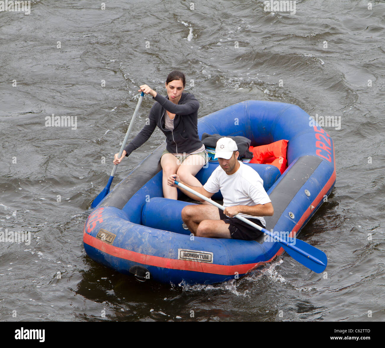 Young couple man and woman rafting on a river Stock Photo - Alamy