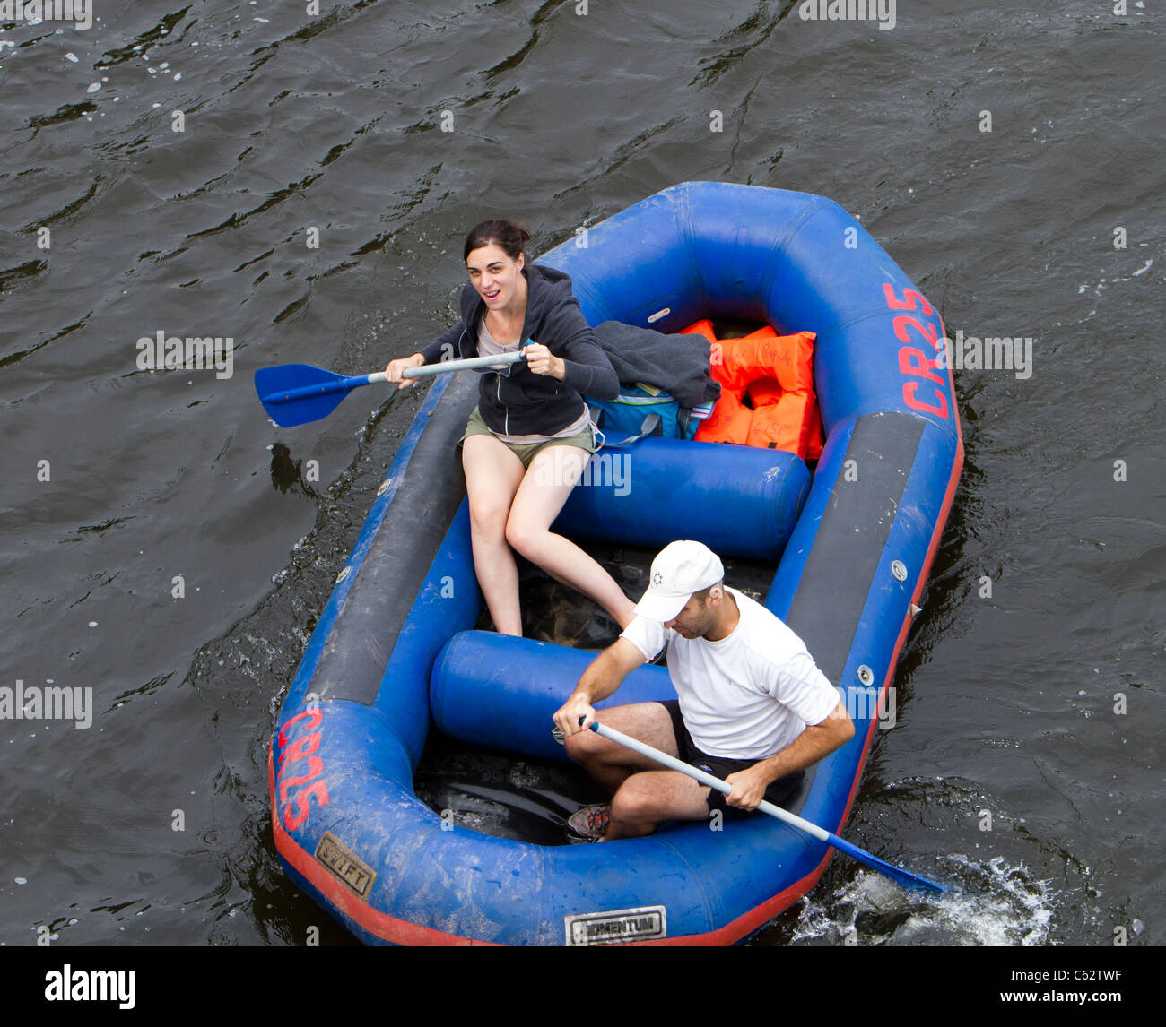 Young couple man and woman rafting on a river Stock Photo - Alamy