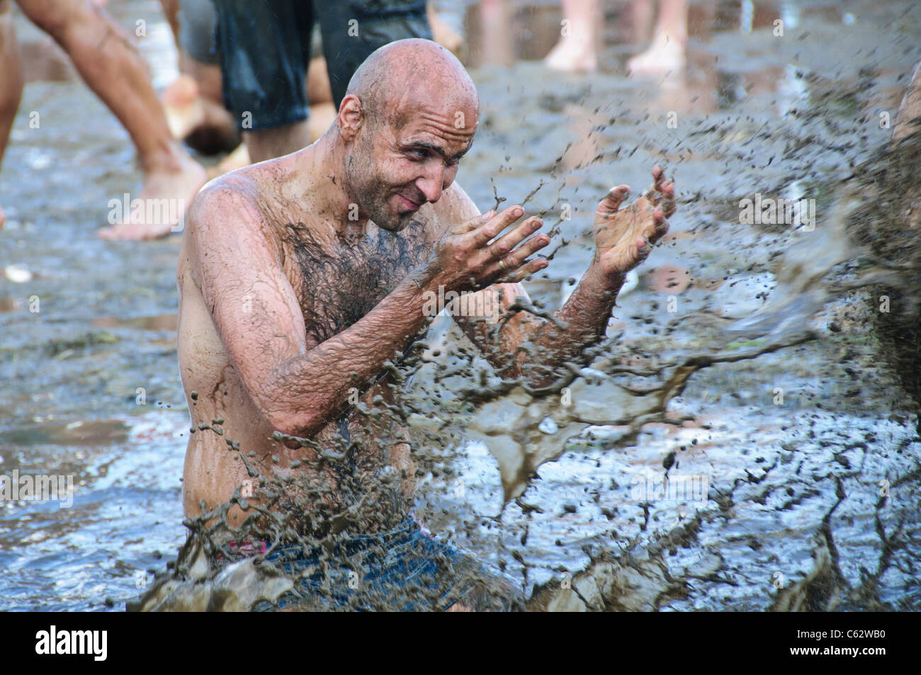 man splashing mud at the Przystanek Woodstock - Europe's largest open ...