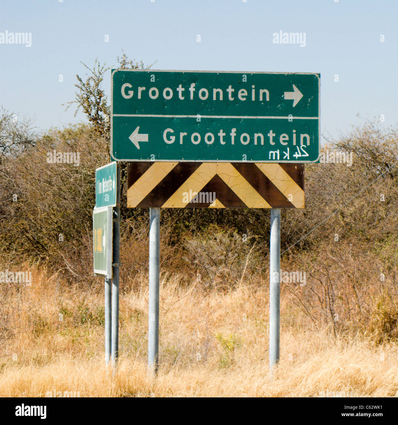 A typically African and Namibian confusing road sign. Grootfontein ...