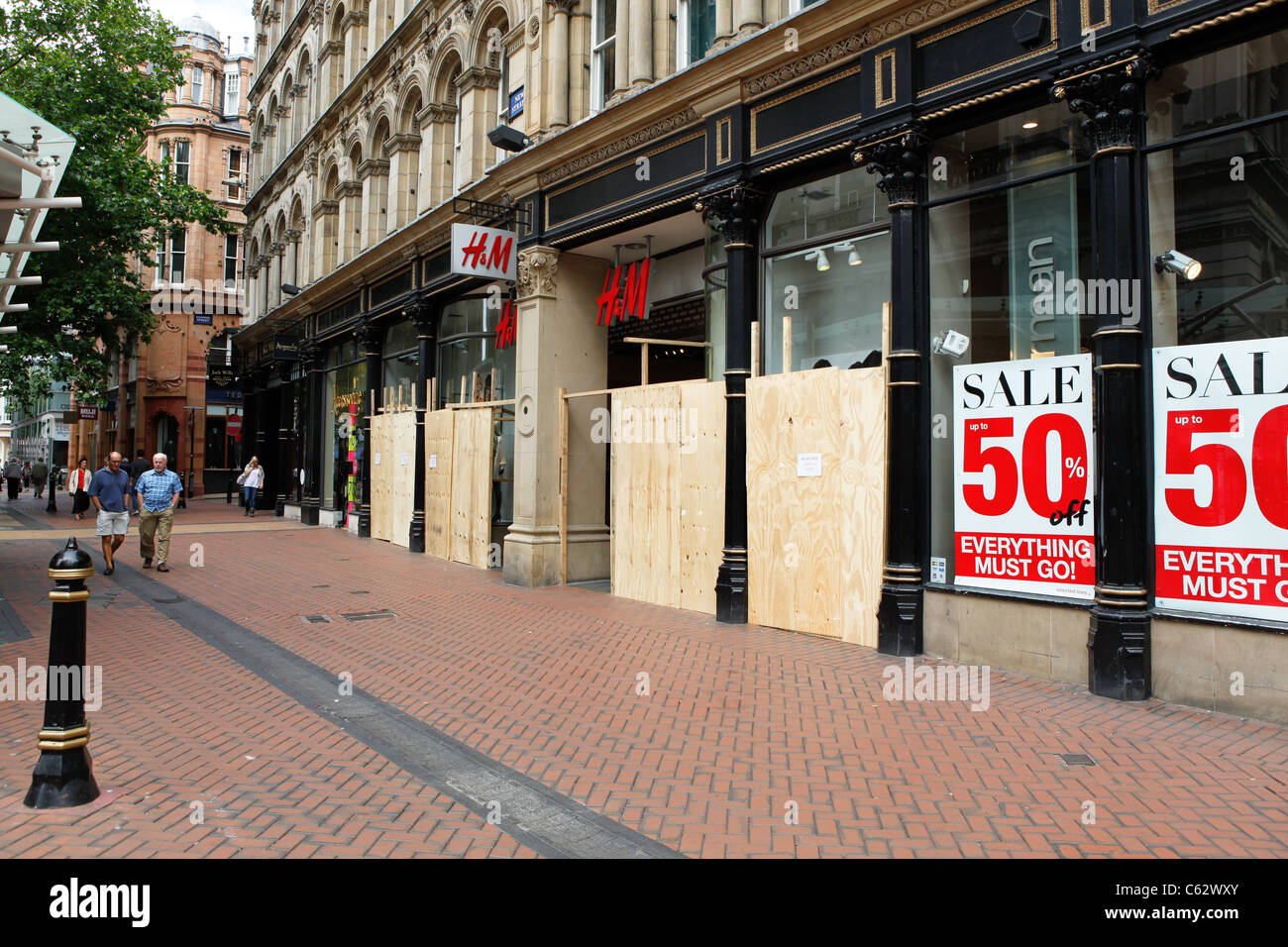 Boarded up shop windows in New Street Birmingham after the riots in ...
